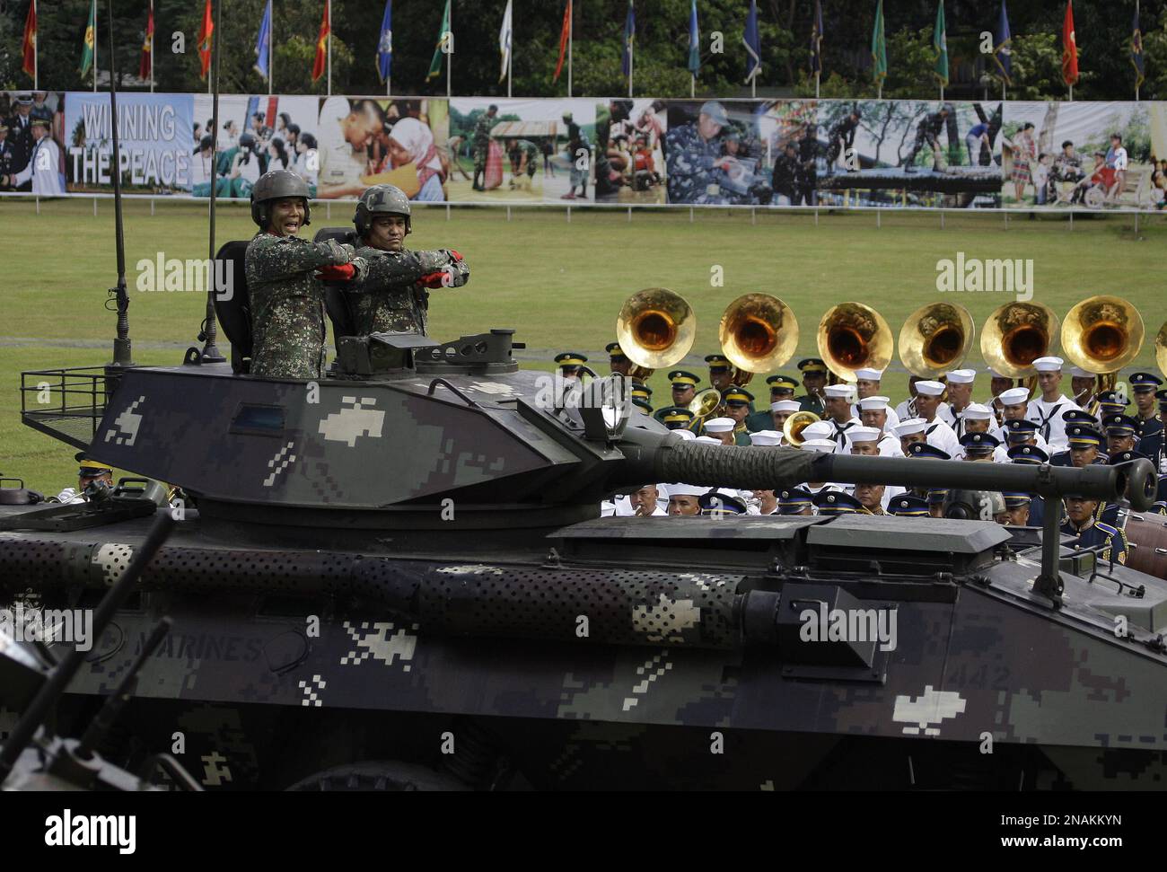 Filipino troopers on board an Armored Personnel Carrier participate in ...