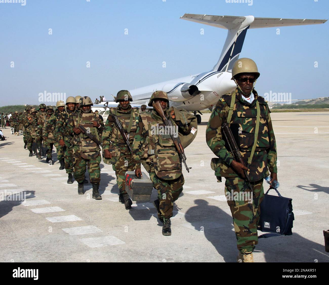 Djibouti soldiers walk in line in Mogadishu, Somalia after disembarking ...