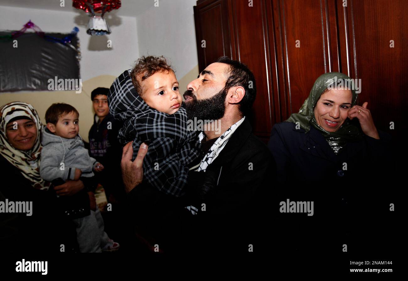 Subhi Jadallah, 35, a released Palestinian prisoner, right, kisses his ...