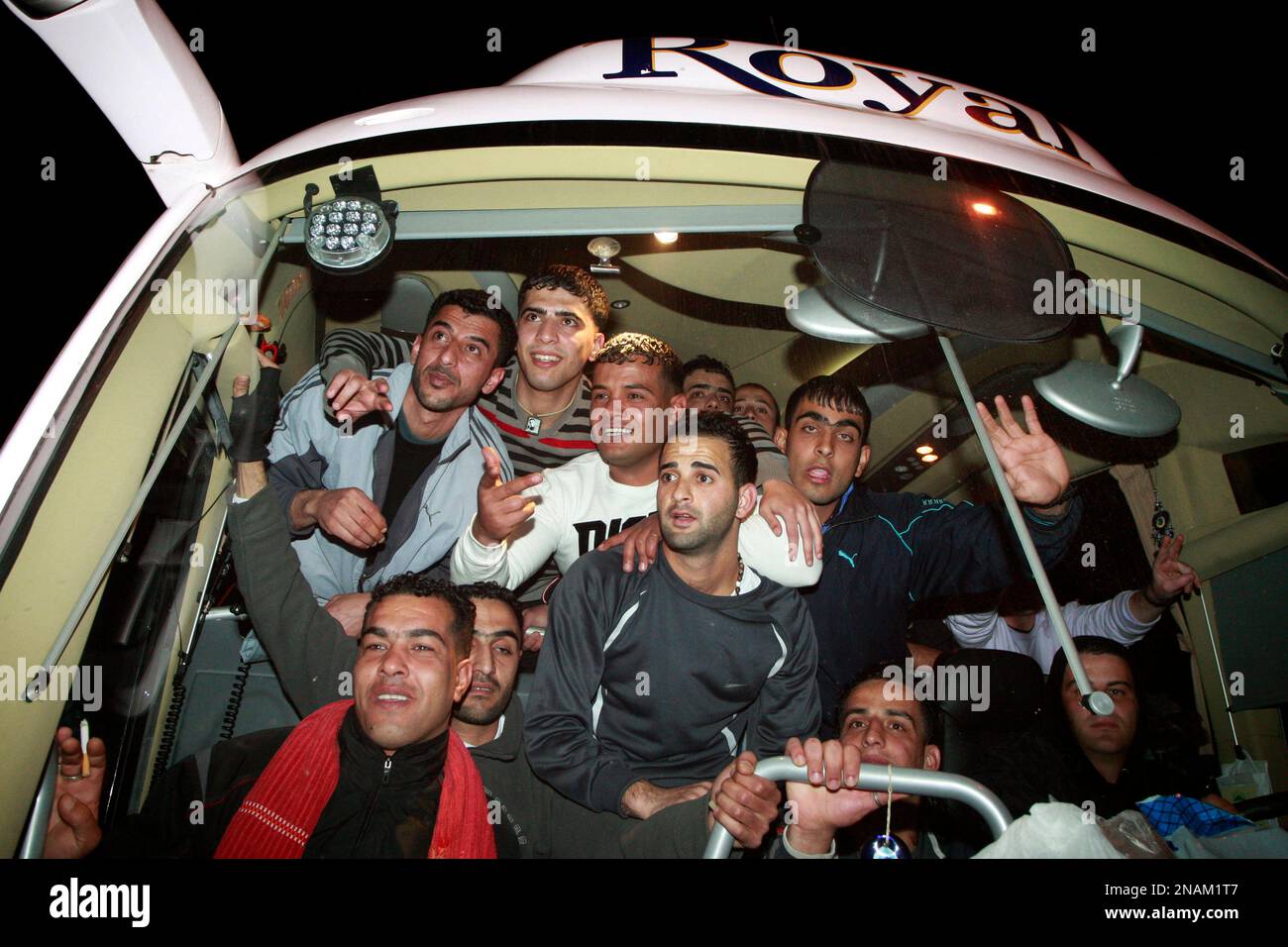 Released Palestinian prisoners arrive at the village of Rafat, near the ...