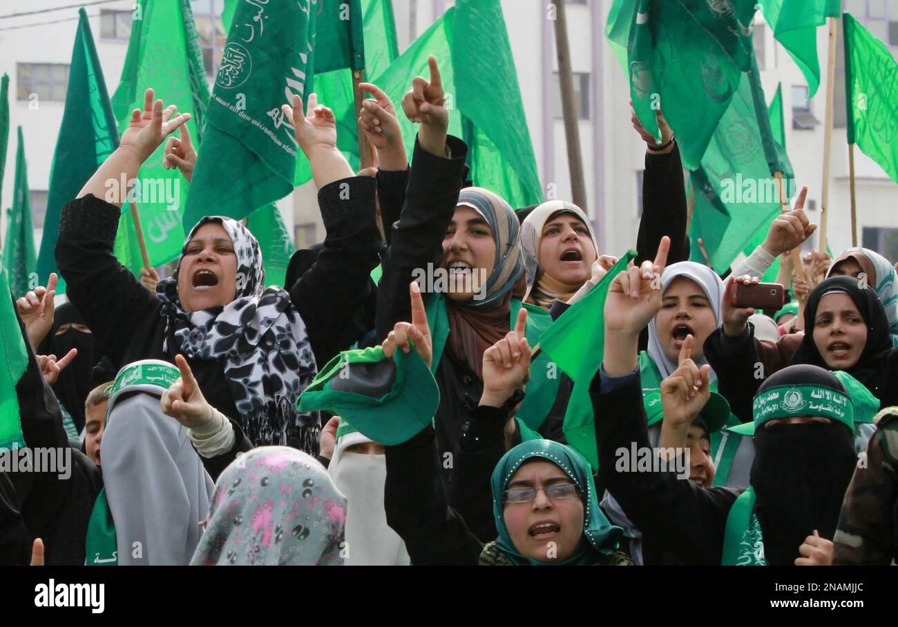 Palestinian women gather during a rally to mark 24 years since Hamas ...