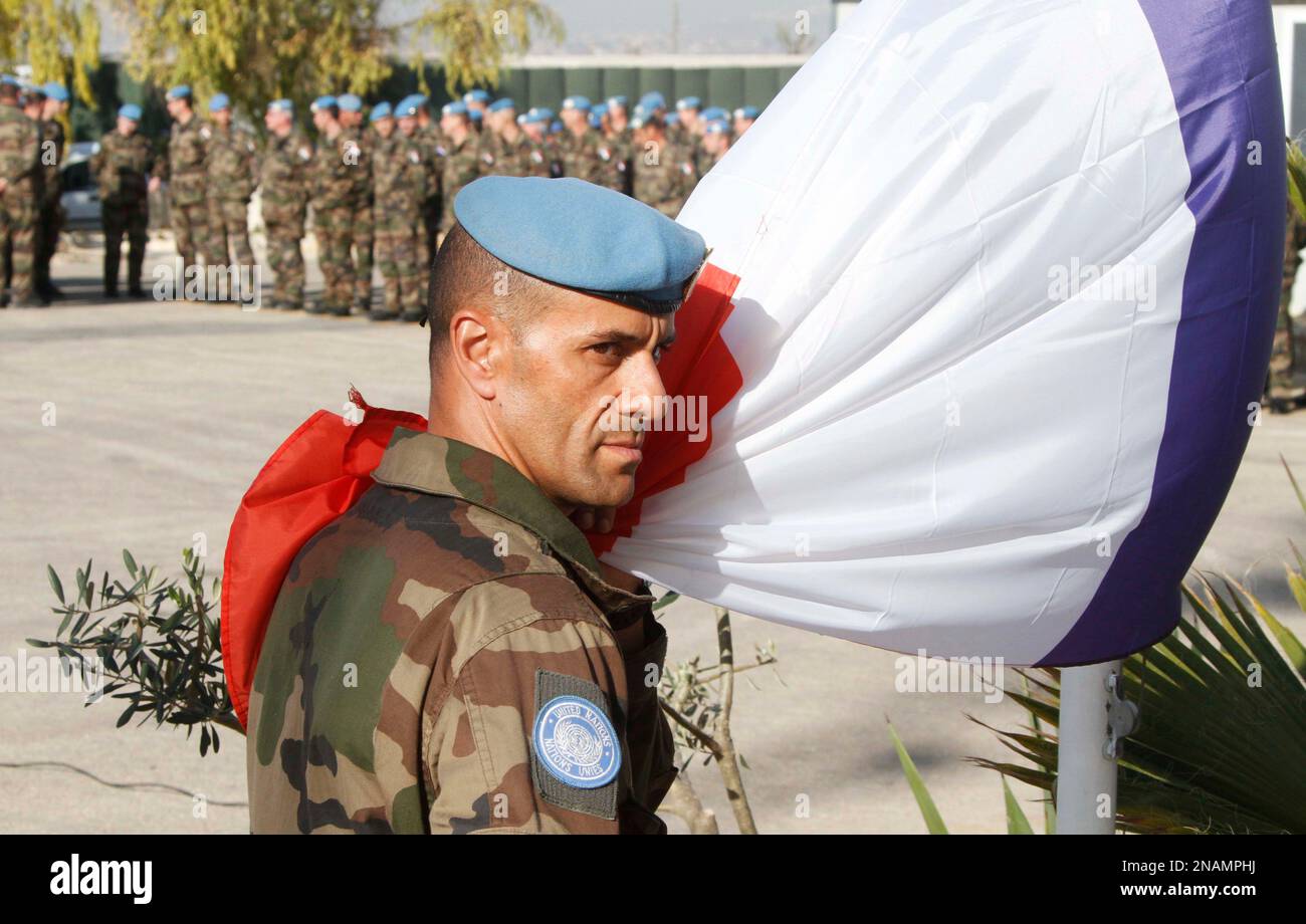 A French U.N. peacekeeper looks on at a ceremony awarding those who ...