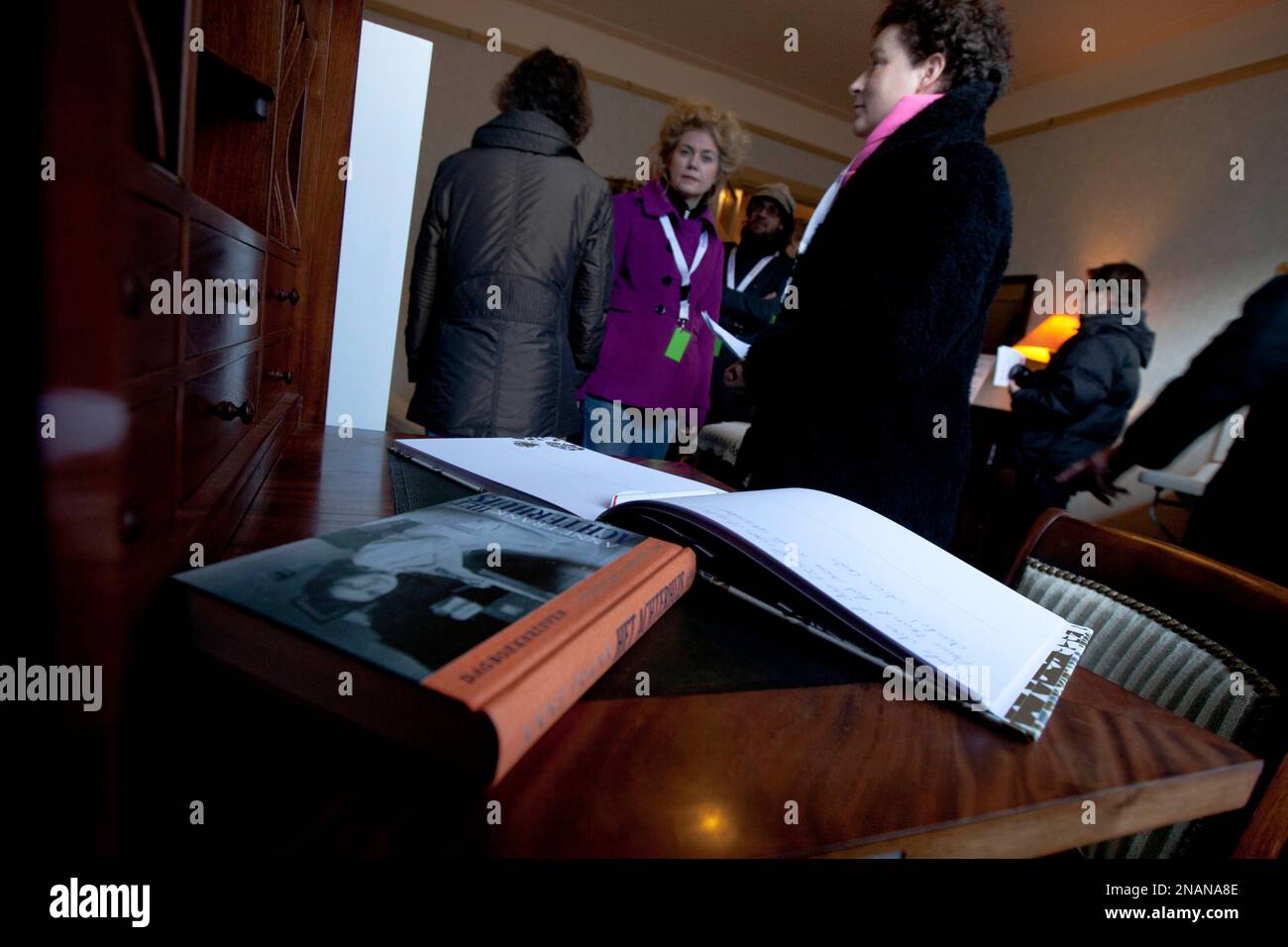 Anne Frank's diary is seen on her writing desk as visitors tour the ...