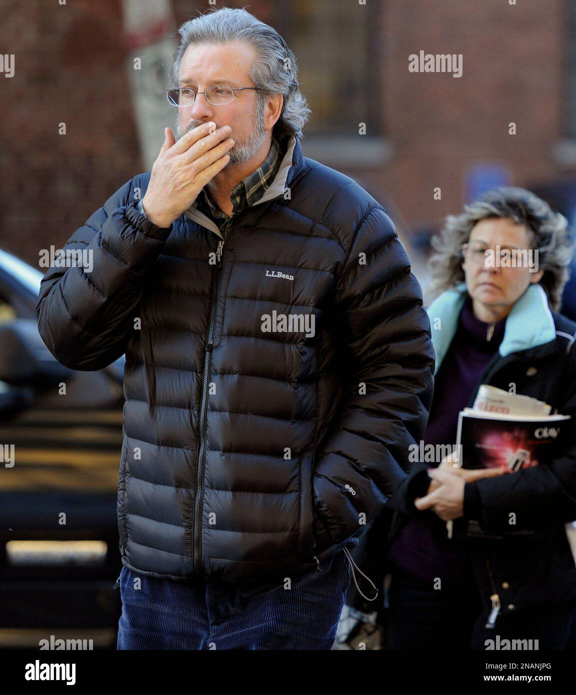 Dr. William Petit Jr., right, touches his face as arrives at Superior ...
