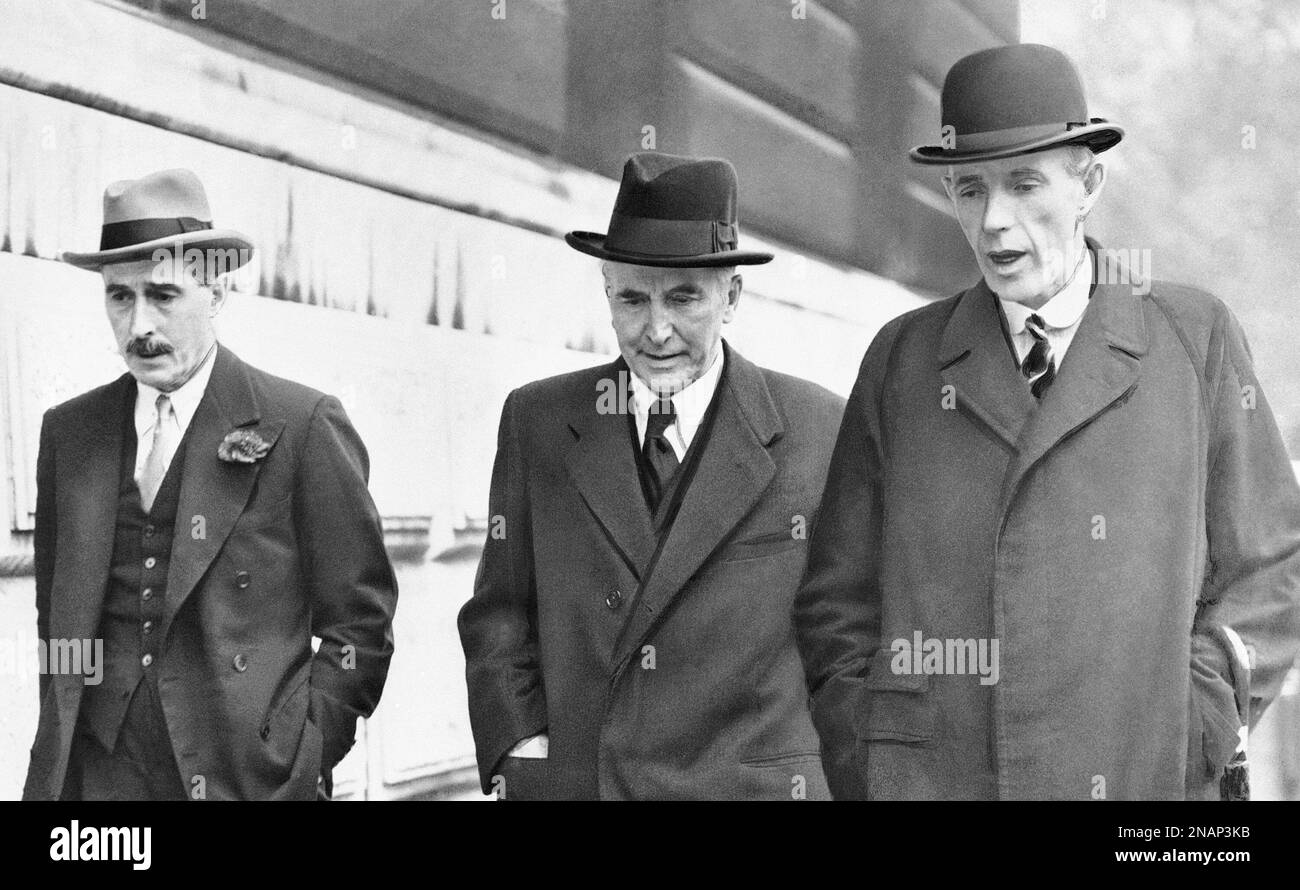 The strain of the moment clearly is visible on the faces of three ...