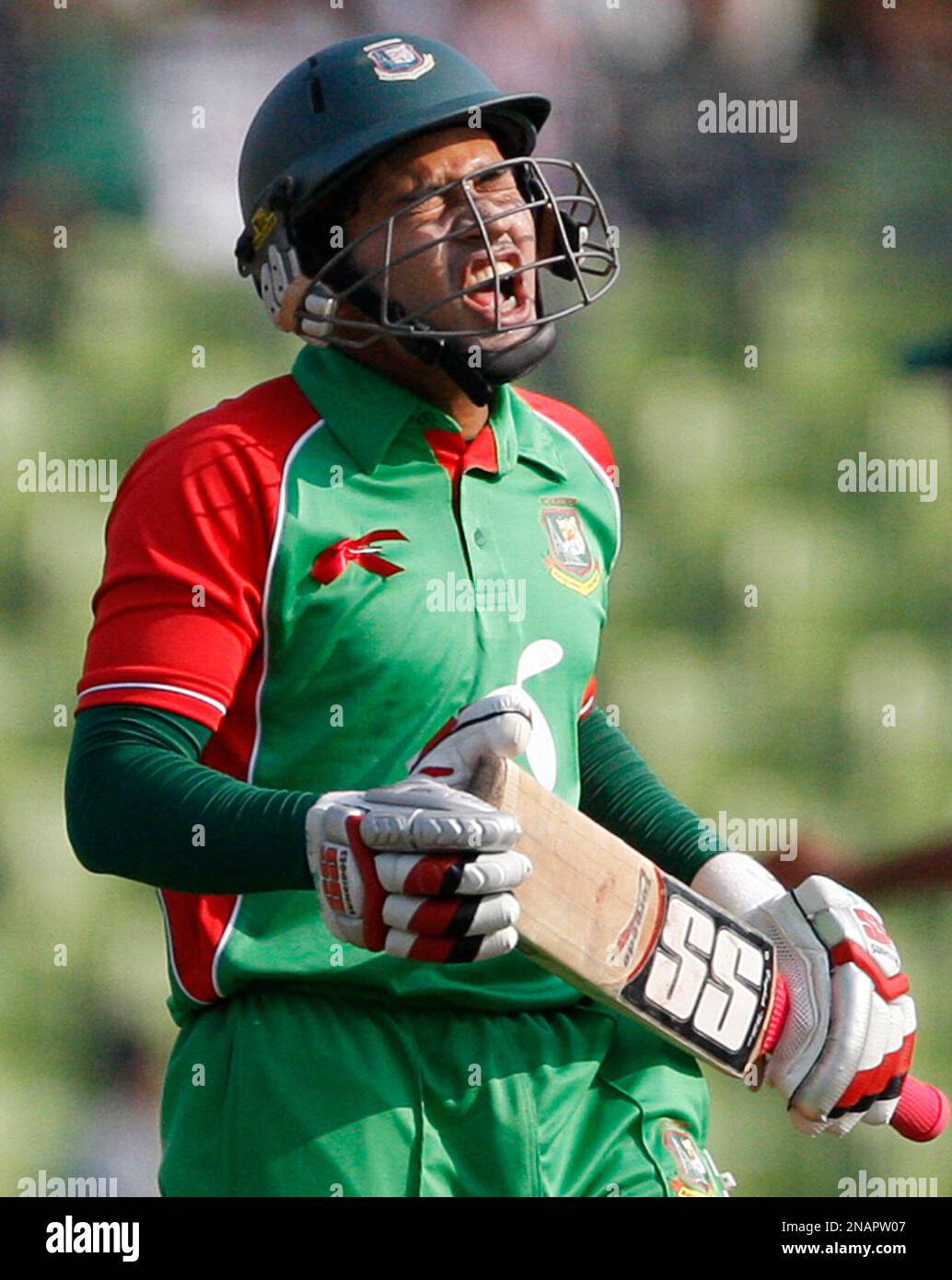 Bangladesh's Mushfiqur Rahim reacts as he walks back after being ...