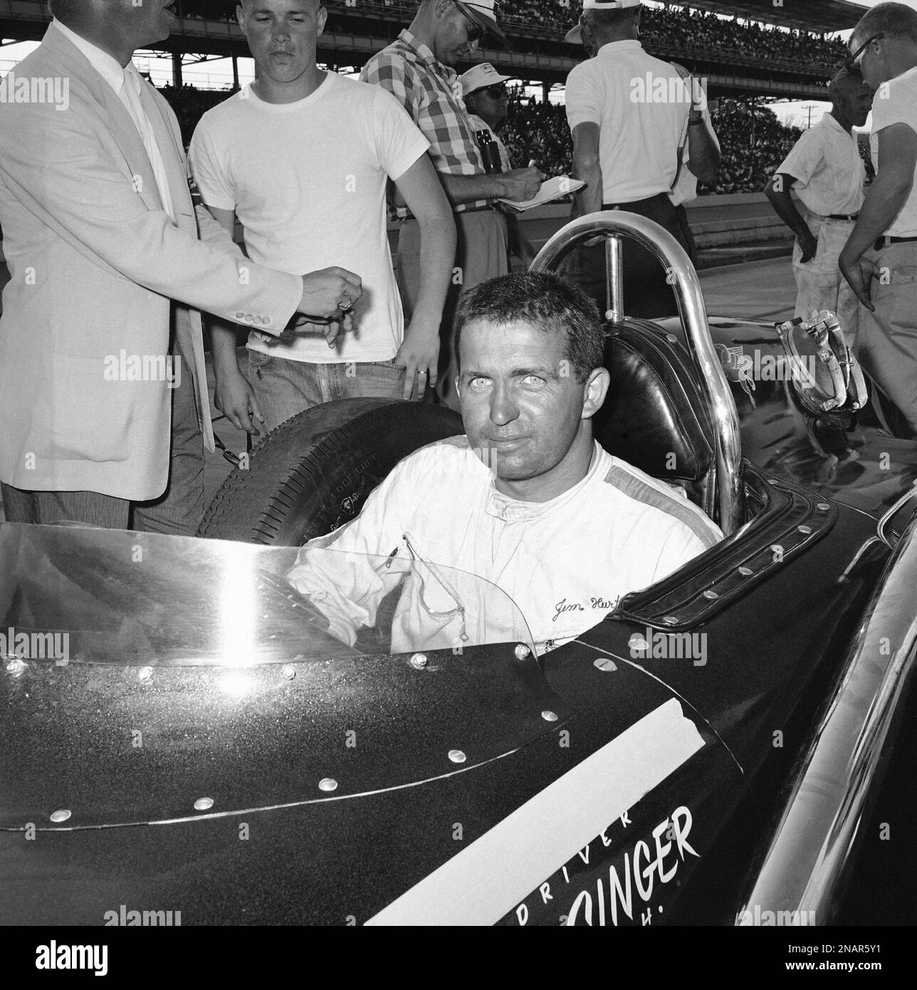 Race car driver Jim Hurtubise, of Lennox, Calif., poses in his Robbins ...