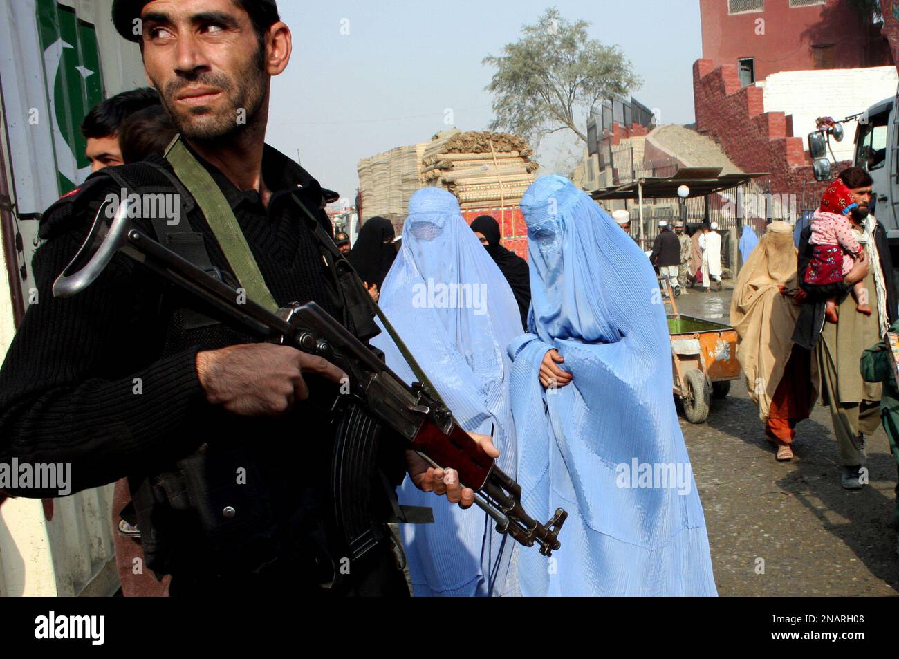 A Pakistani border security guard stands alert as authorities close ...