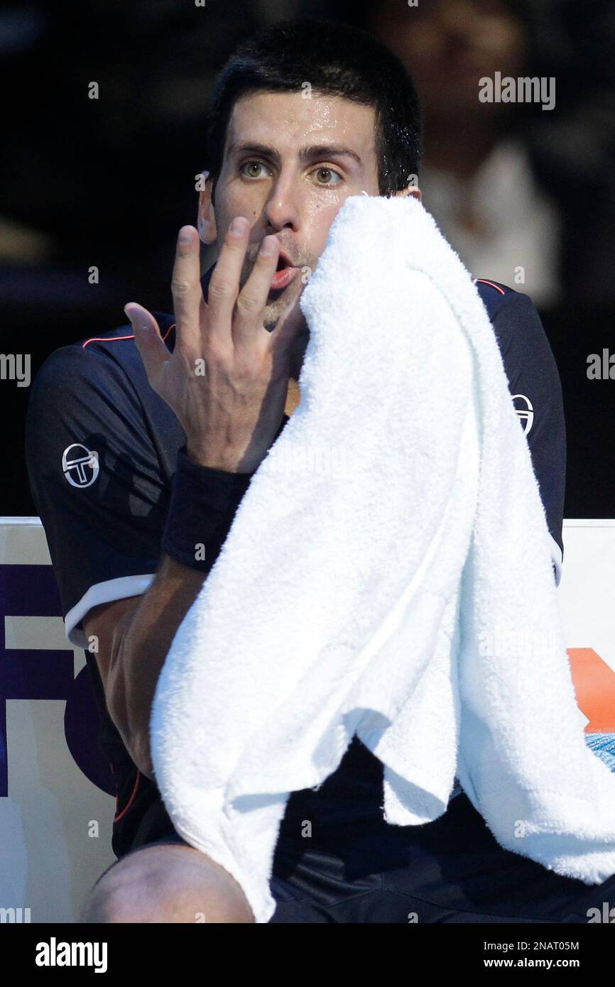 Serbia's Novak Djokovic reacts on the bench after losing a game to ...