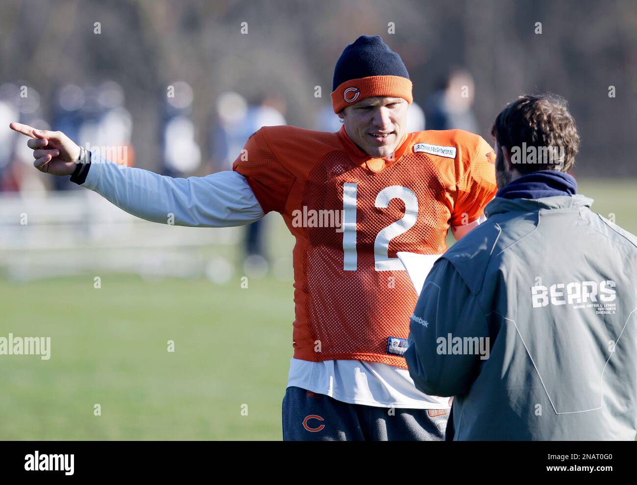 Chicago Bears quarterback Caleb Hanie points as he talks with ...