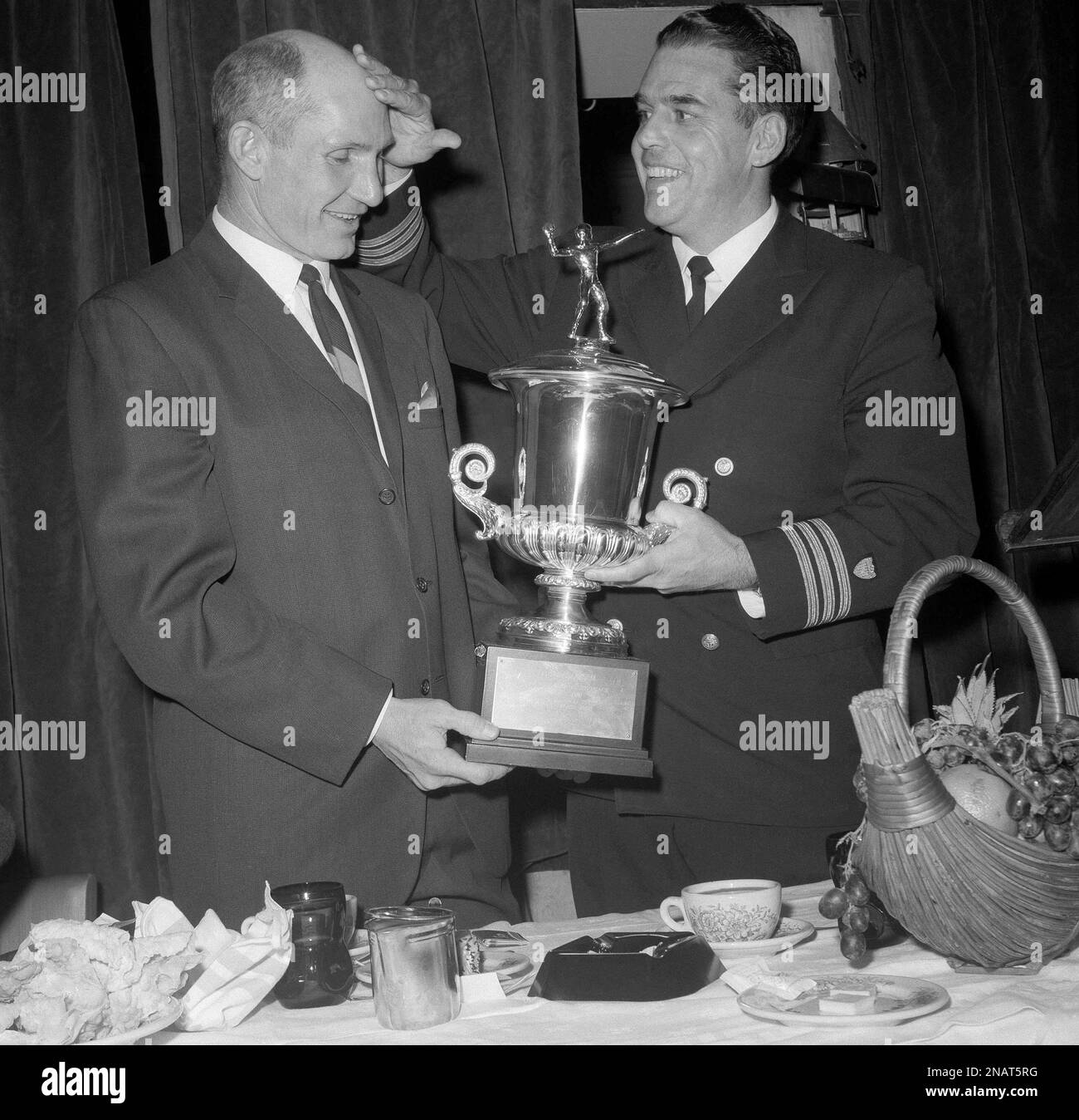 Otto Graham, former star of the Cleveland Browns, pats the bald pate of ...