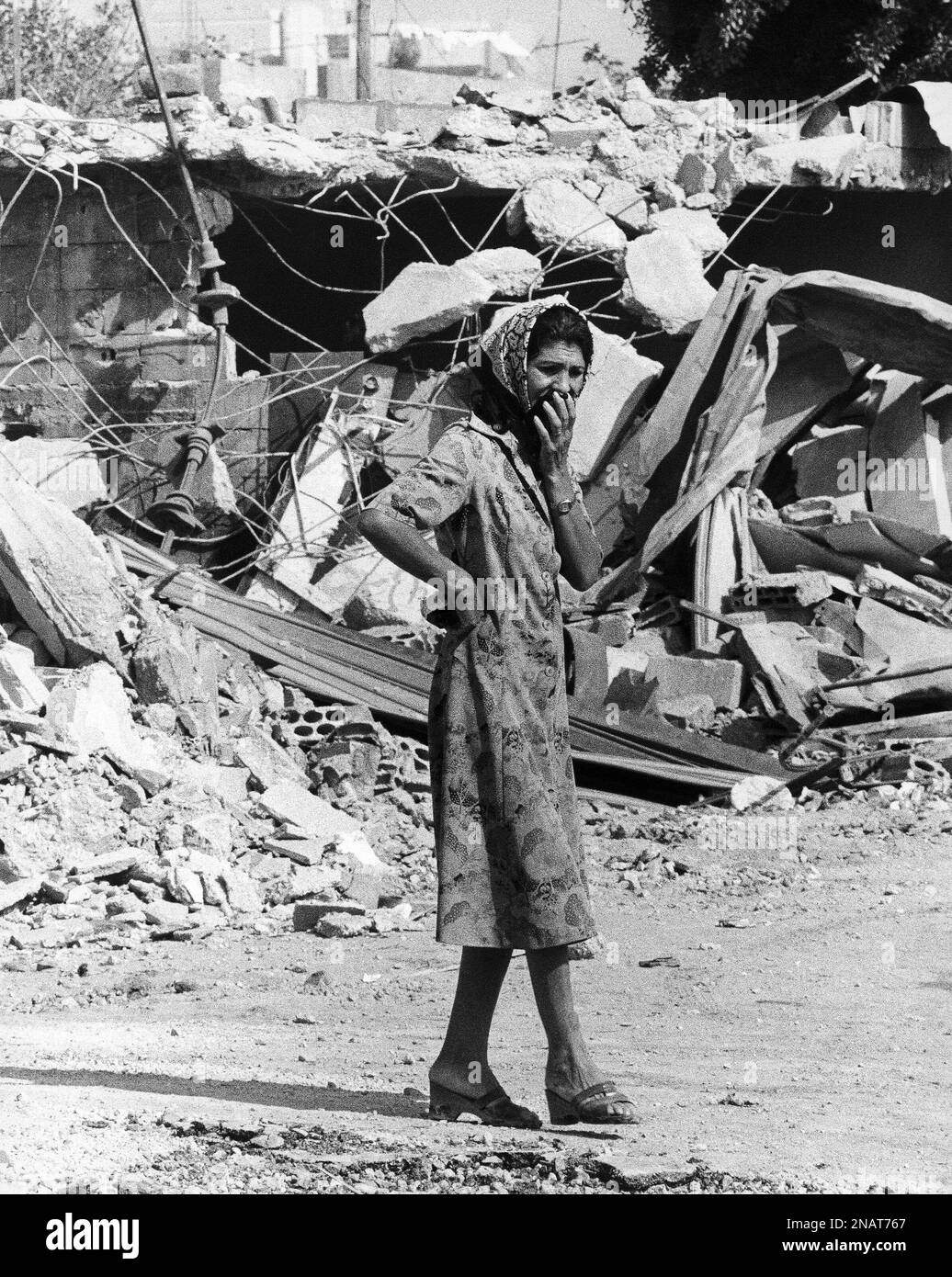 A Palestinian woman stands in the Sabra Palestinian camp, Beirut ...