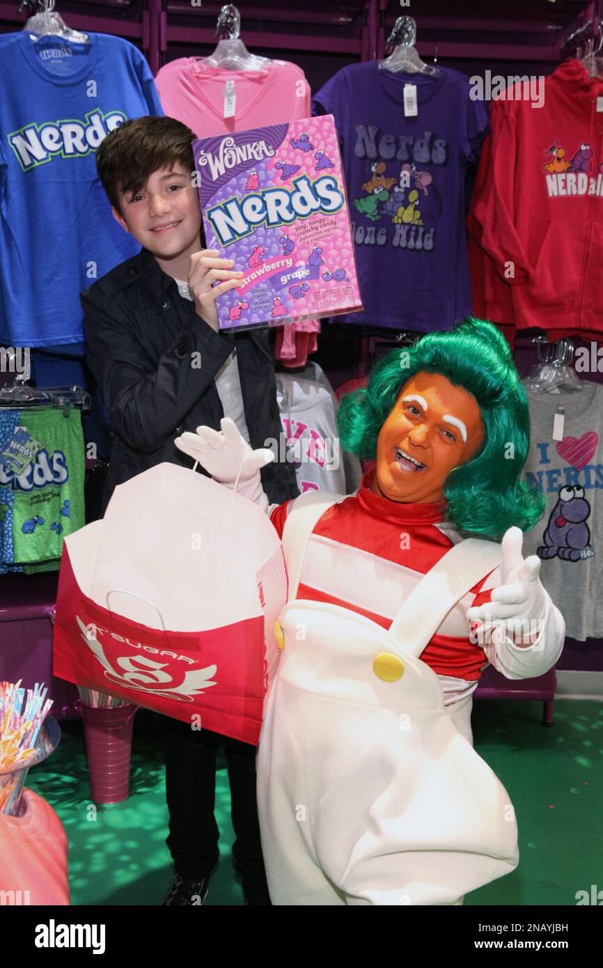 Greyson Chance swaps candy with an Oompa Loompa at the Wonka Candy ...
