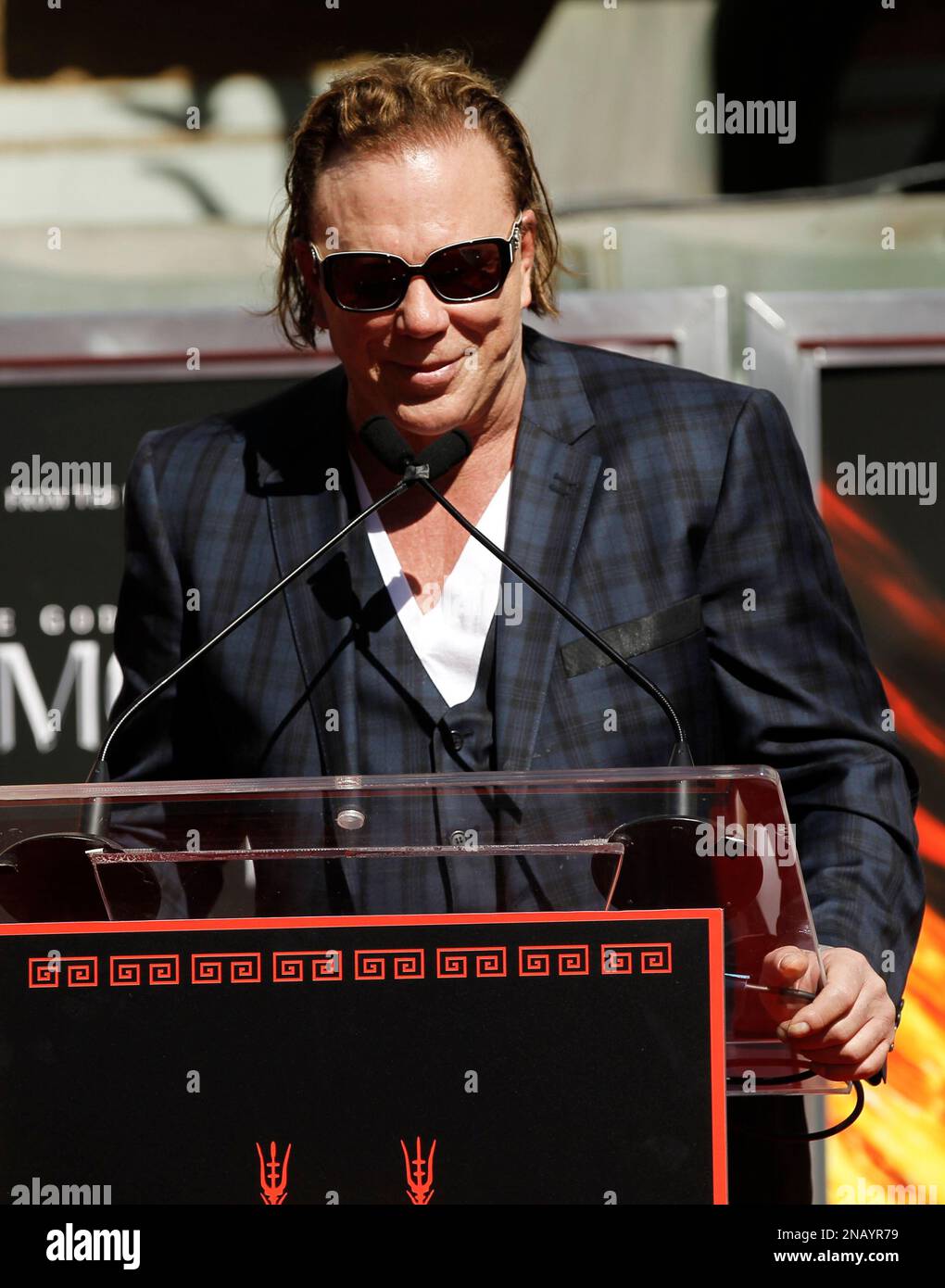 Actor Mickey Rourke speaks during his hand and footprint ceremony in ...