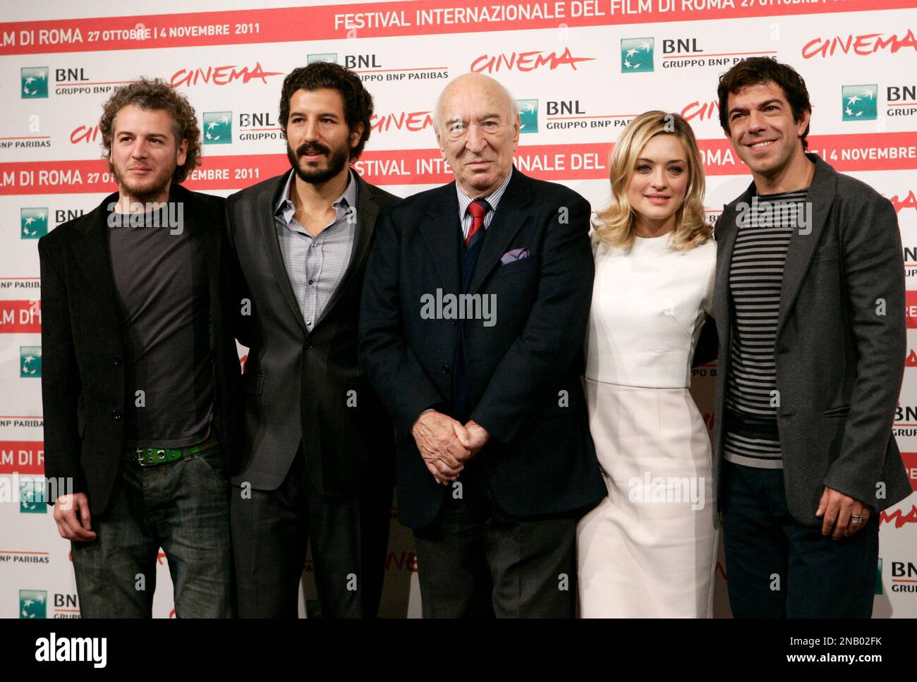 Italian director Giuliano Montaldo, center, poses with actors, from ...