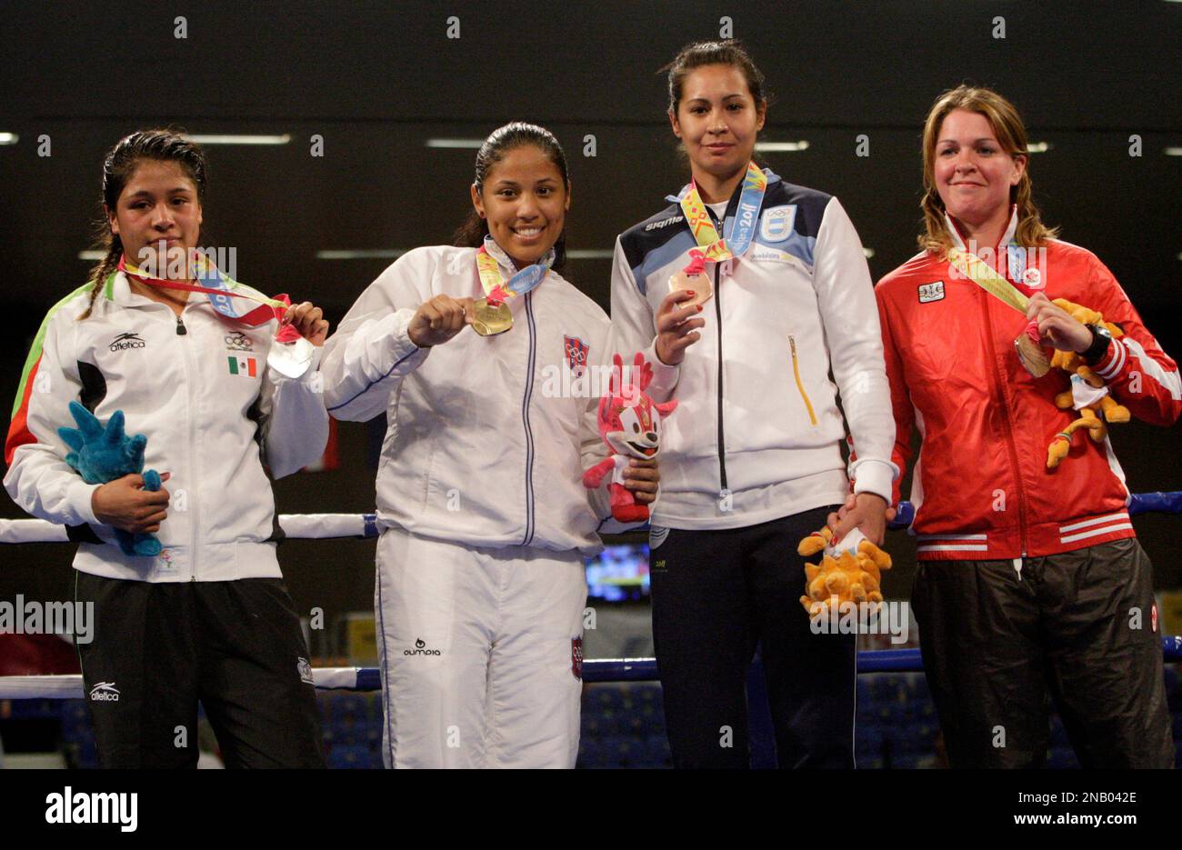 Gold medal winner Puerto Rico's Kiria Tapia, second from left, shares ...