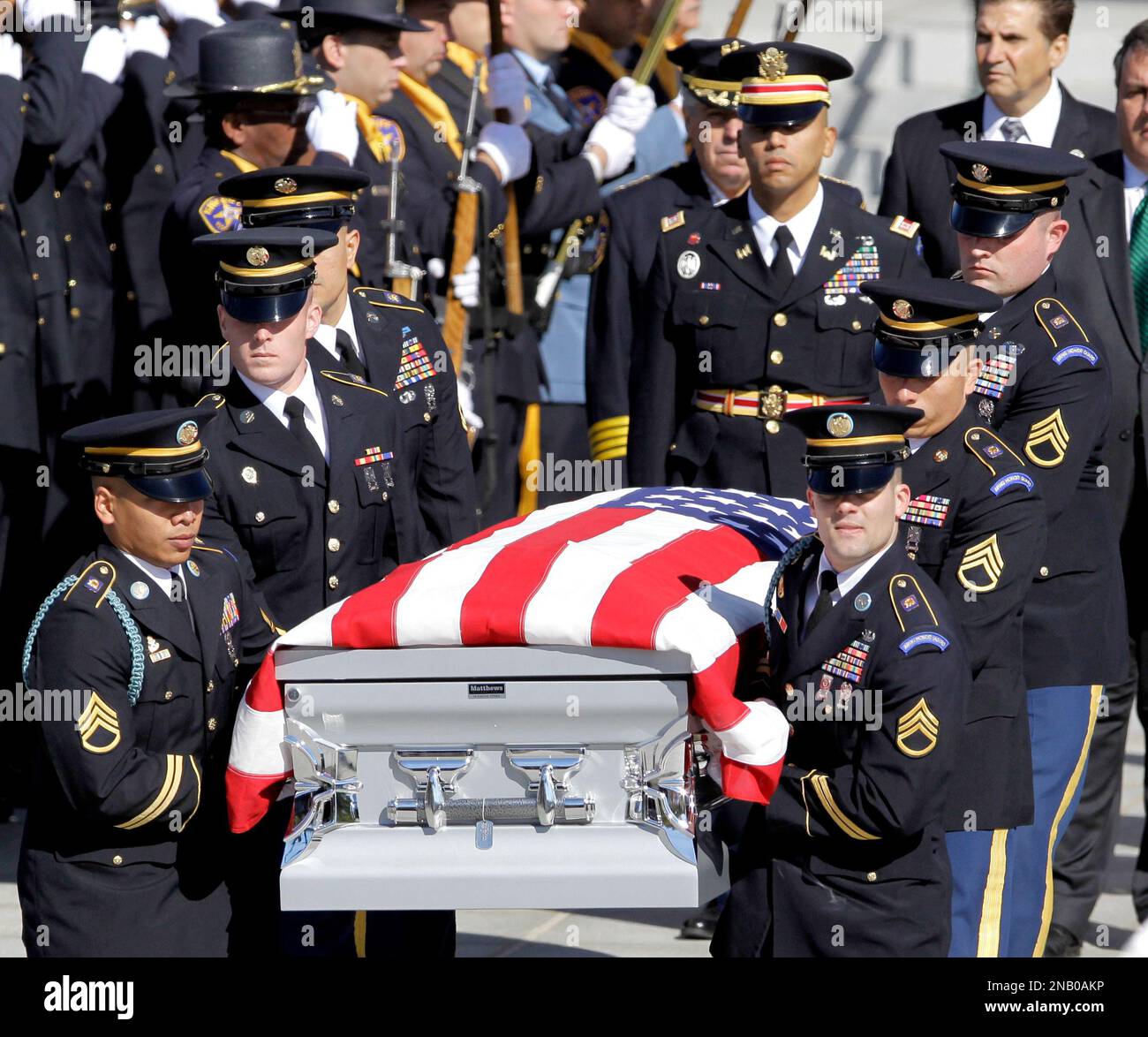 Pallbearers carry the casket of Staff Sgt. Jorge Oliveira after a ...