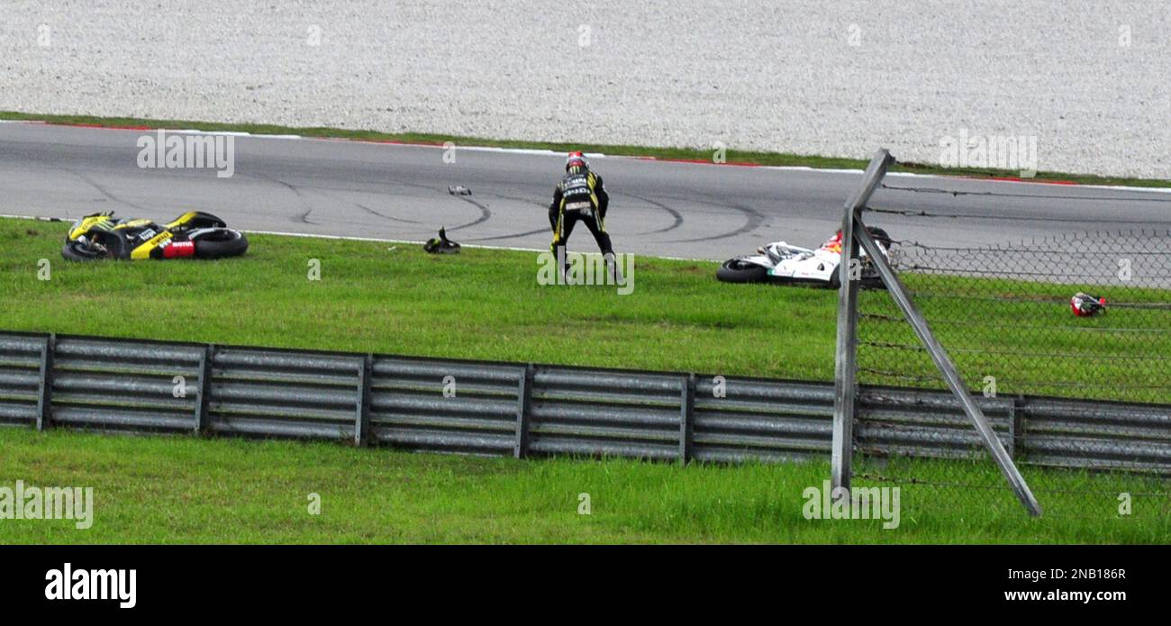 Colin Edwards of the U.S., reacts after the crash involving other two ...