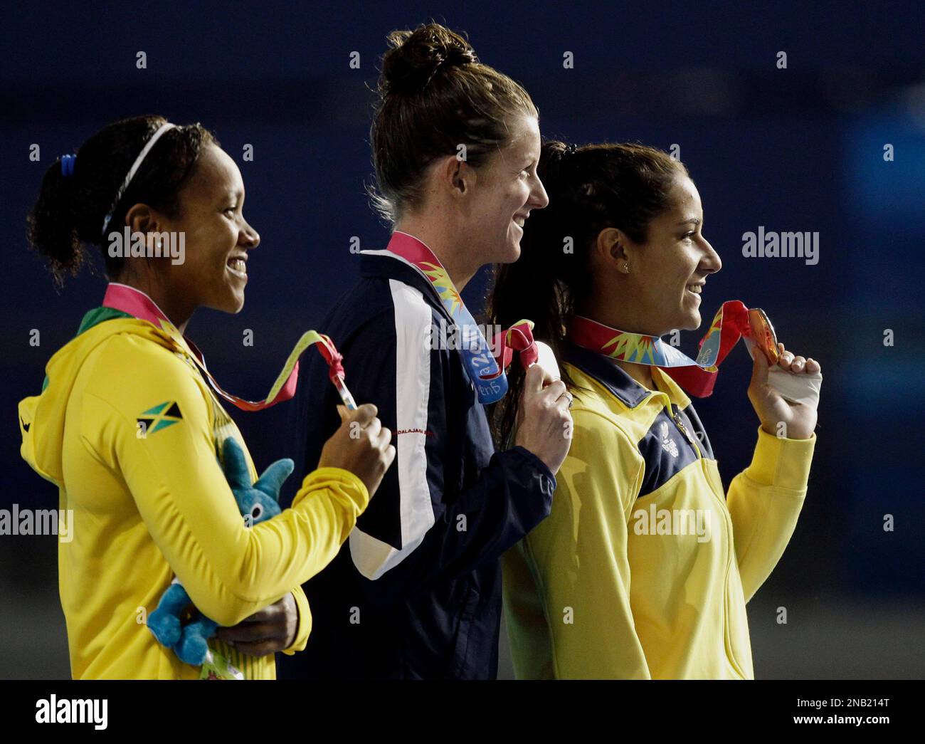 Athletes, from left to right, Jamaica's Alia Atkinson, silver medal ...