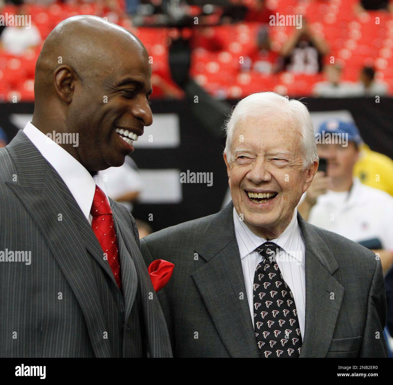 Former President Jimmy Carter, right, speaks to former NFL football ...