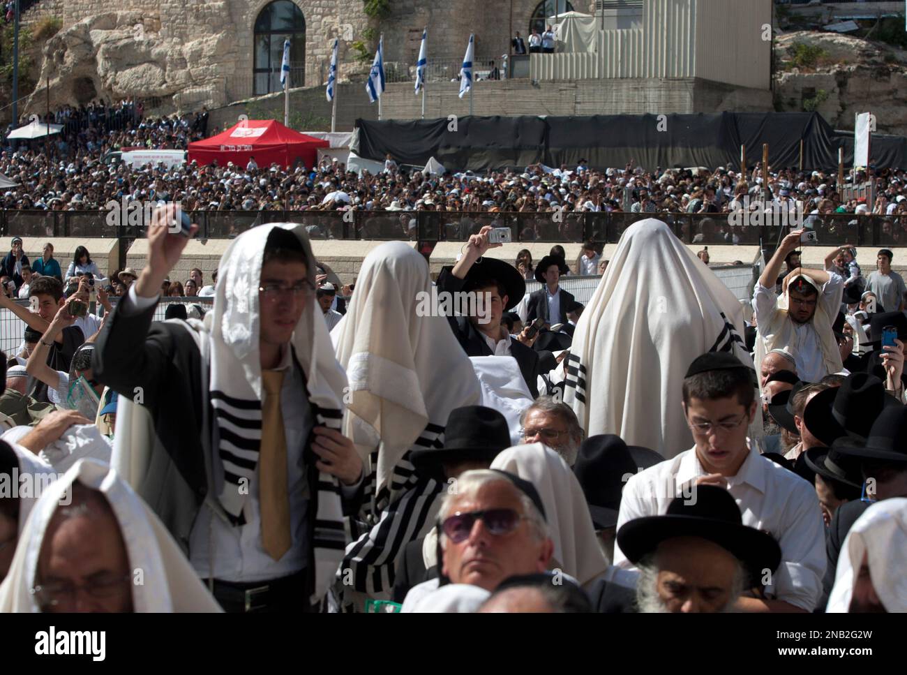 Covered in prayer shawls, ultra-orthodox Jewish men of the Cohanim ...
