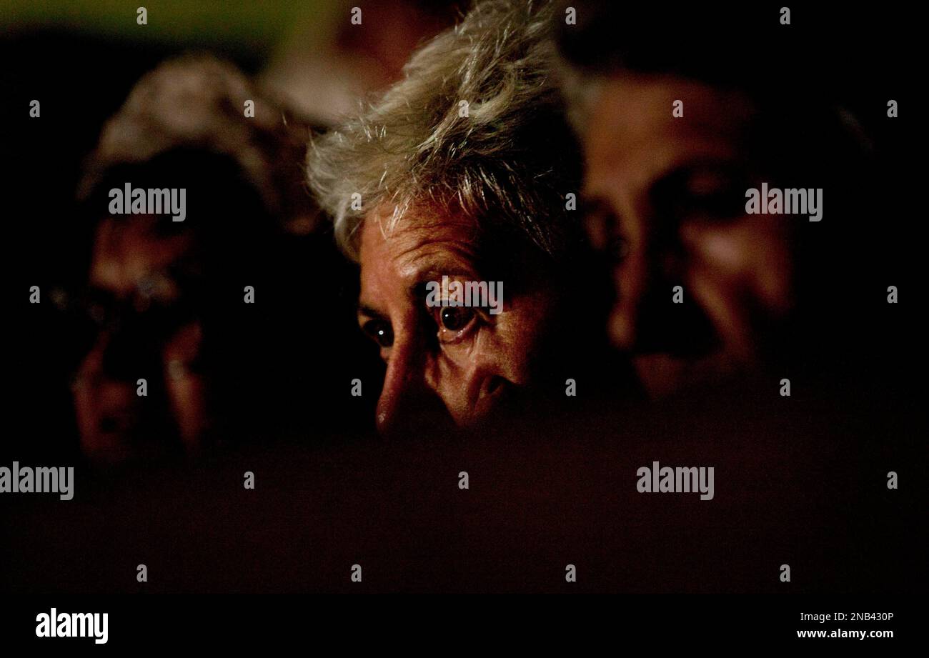 Holocaust survivors and family members participate in a ceremony ...