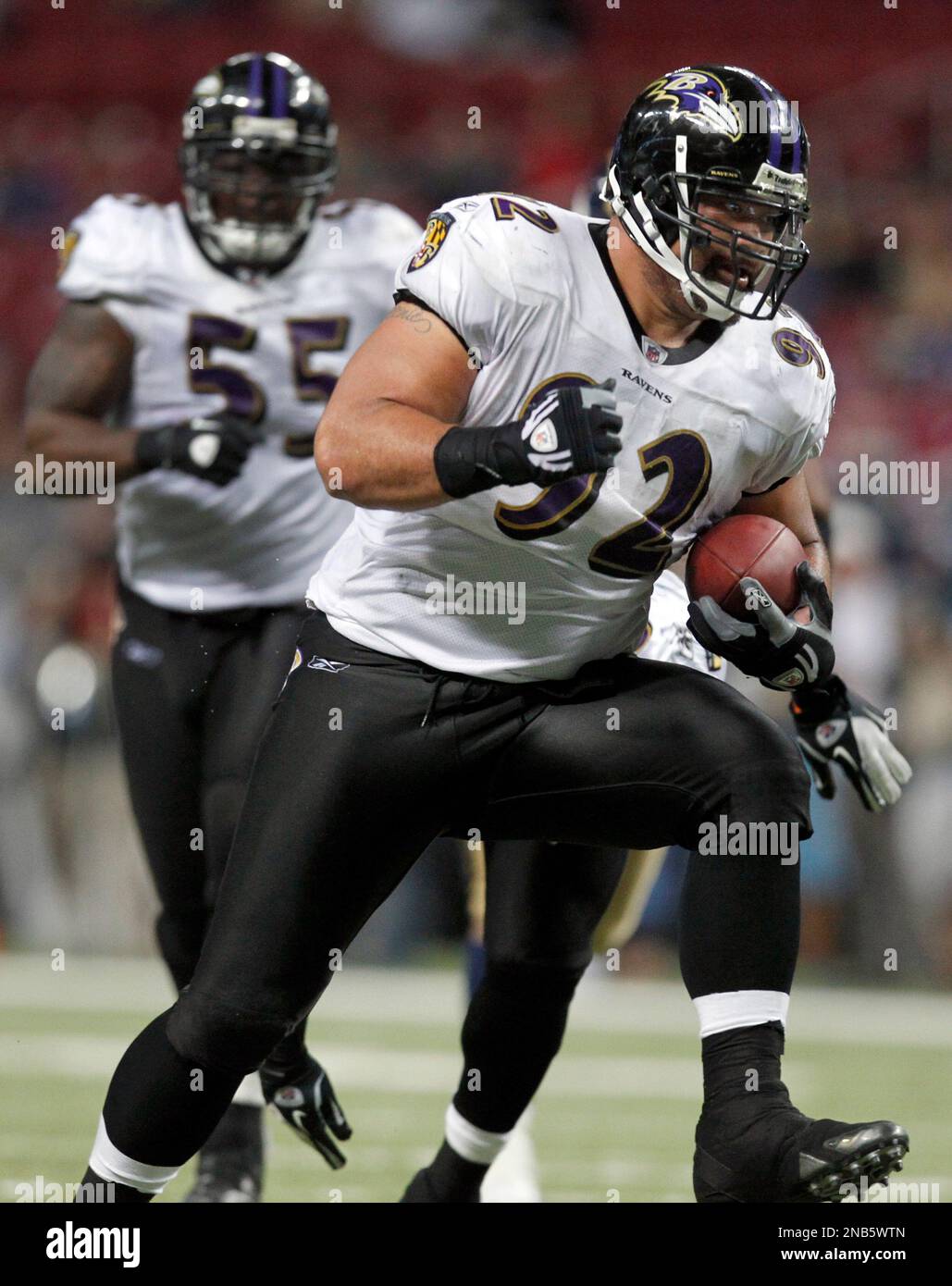 Baltimore Ravens nose tackle Haloti Ngata, right, runs in to score as ...