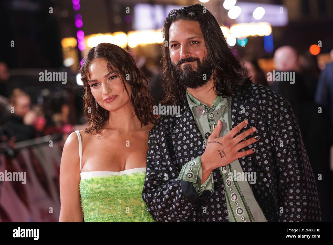 Shazad Latif, right, and Lily James pose for photographers upon arrival ...
