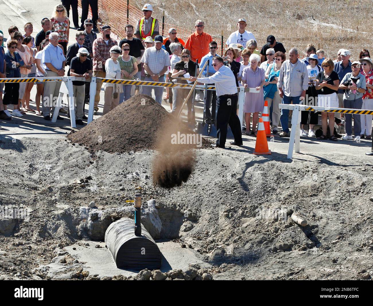 San Bruno Mayor Jim Ruane pours ceremonial dirt on the crater in San ...
