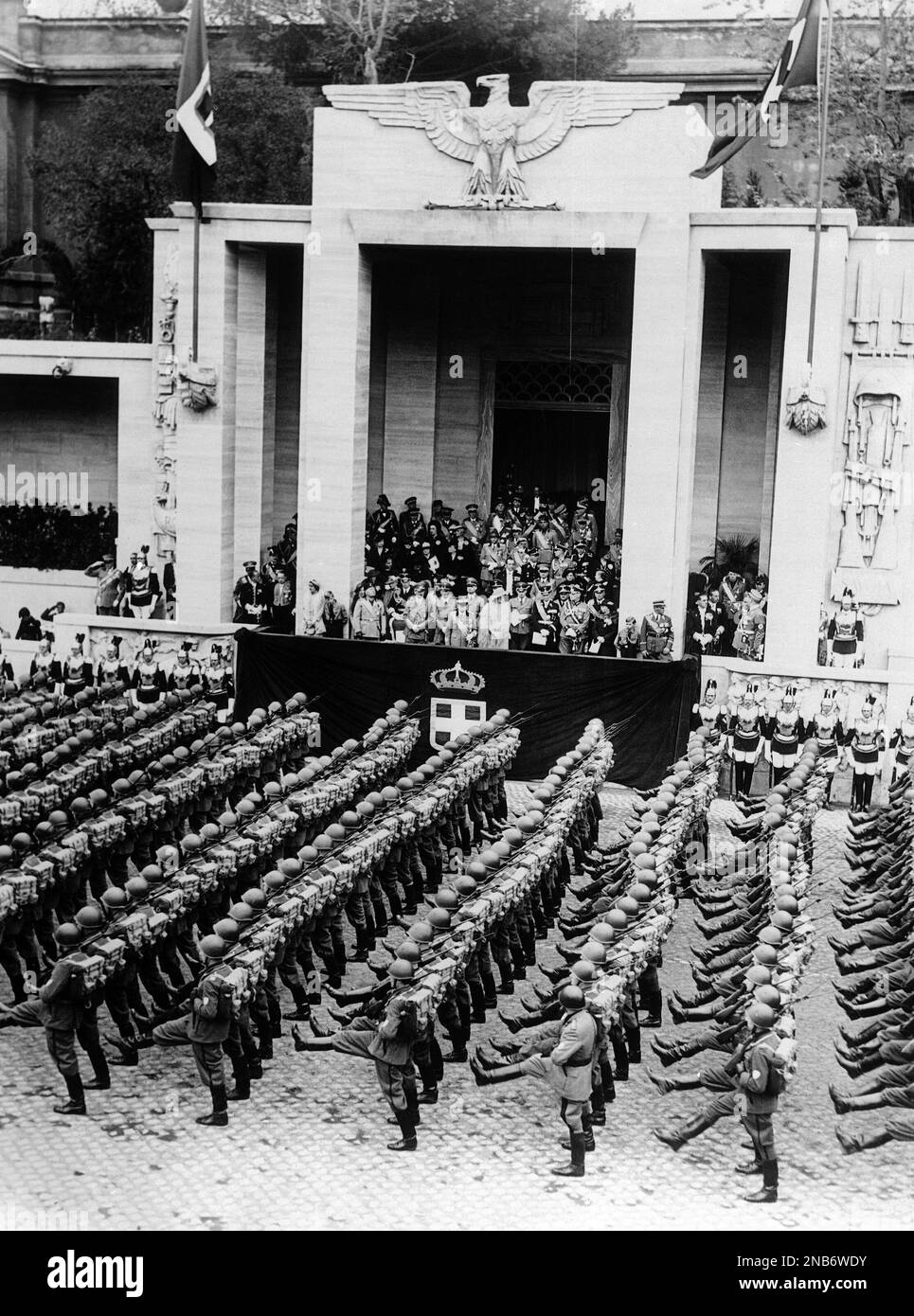 German Chancellor Adolf Hitler, standing in a raised platform facing ...