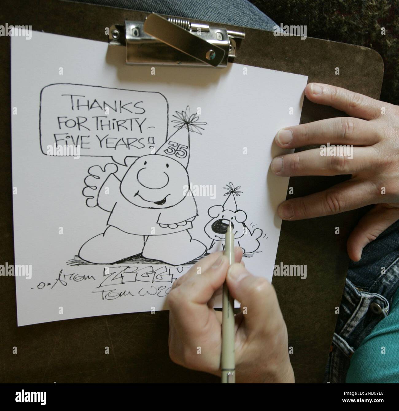 FILE - In this June 23, 2006 photo, Artist Tom Wilson Jr. draws a Ziggy cartoon celebrating the ...