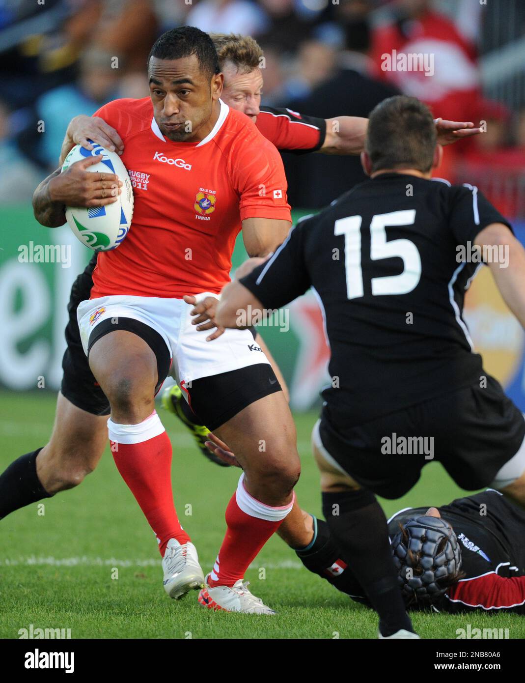 Tonga's Fetu'u Vainikolo, left, runs at Canada's James Pritchard during ...