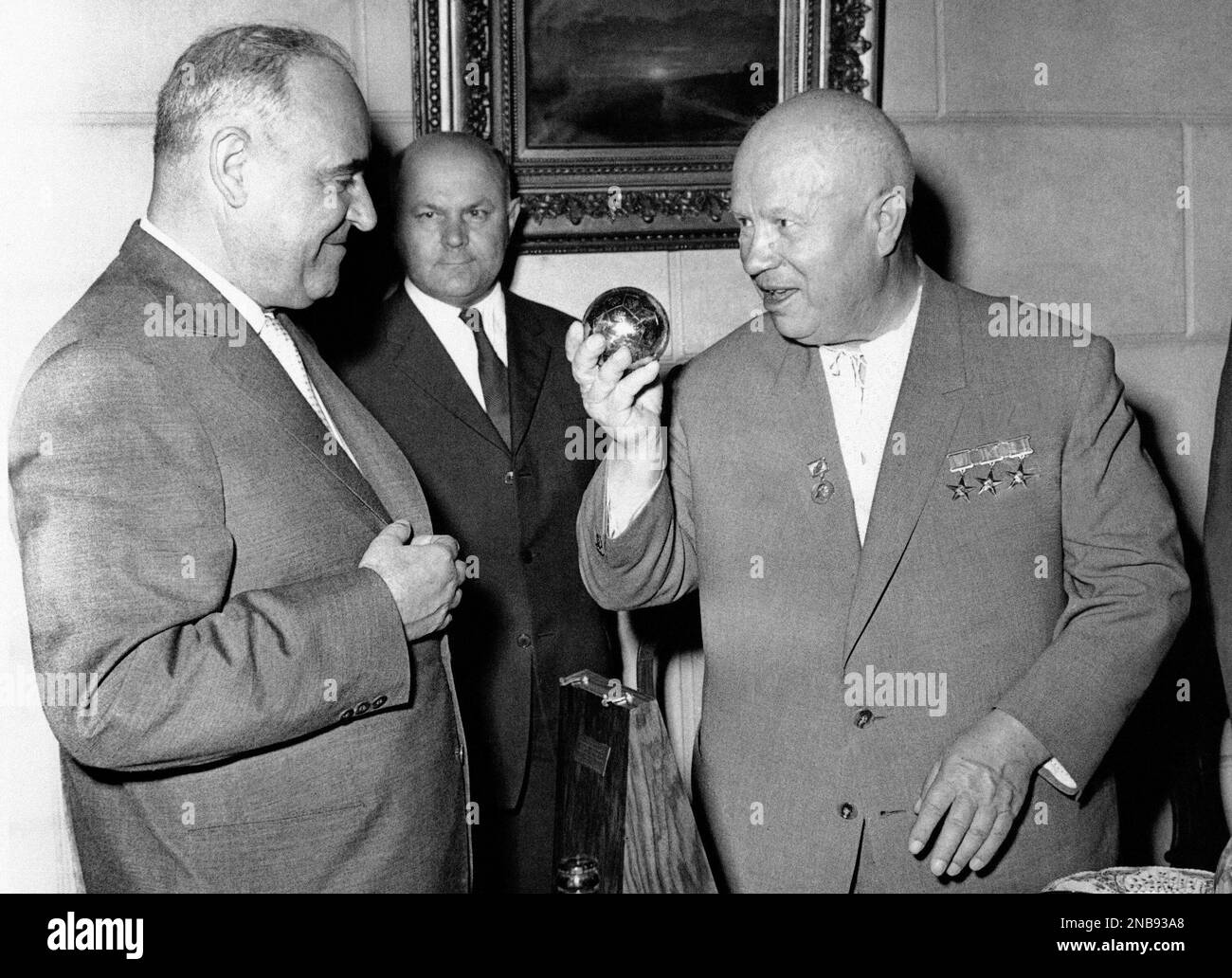 Soviet Premier Nikita Khrushchev, right, presents a replica of a Soviet ...