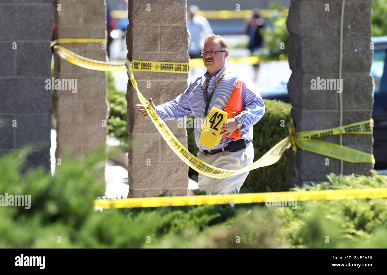 Carson City Sheriff's officials investigate the scene of a shooting in ...