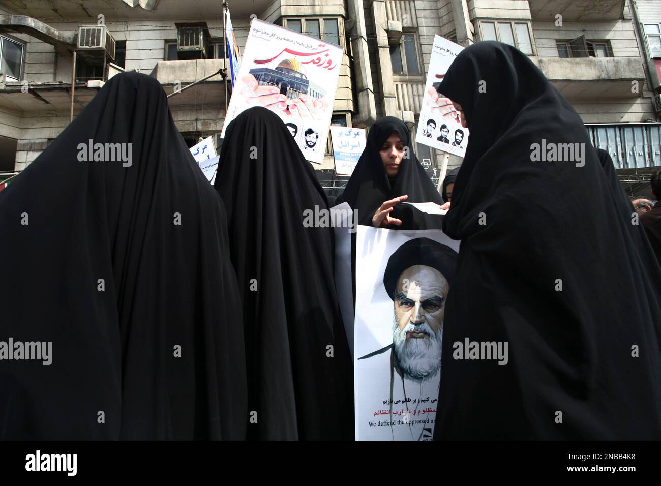 Head-to-toe veiled Iranian women, attend an annual nation-wide pro ...