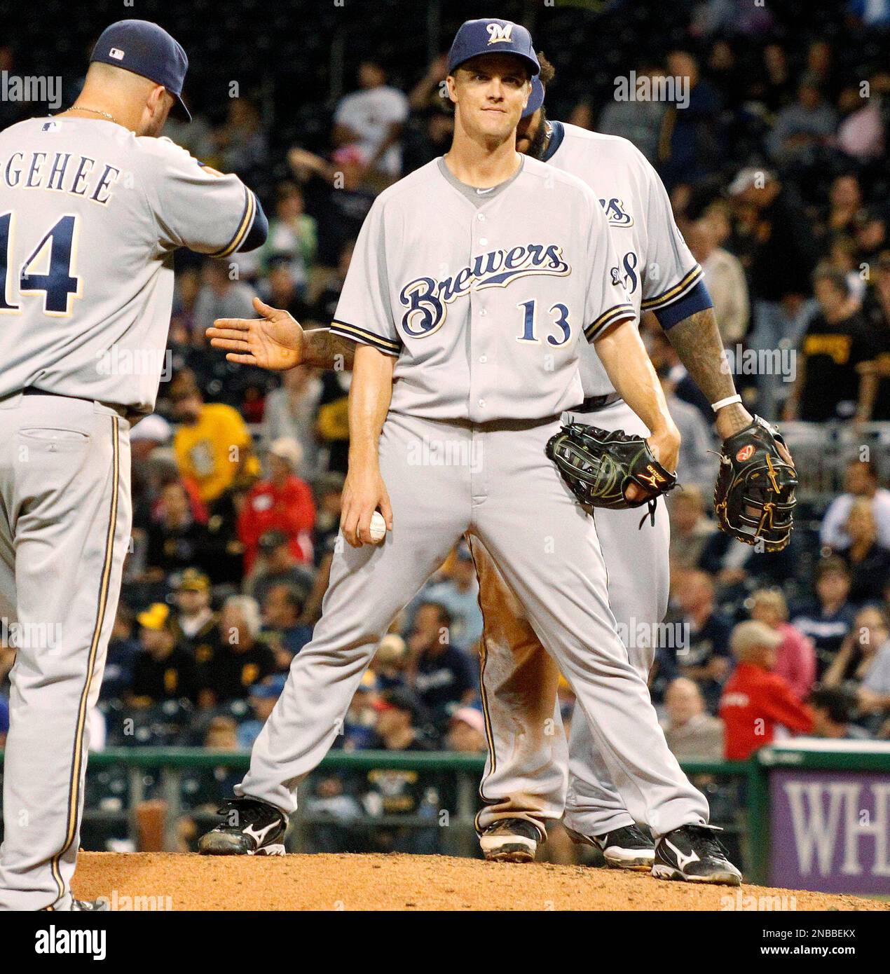 Milwaukee Brewers starting pitcher Zack Greinke (13) stands on the ...
