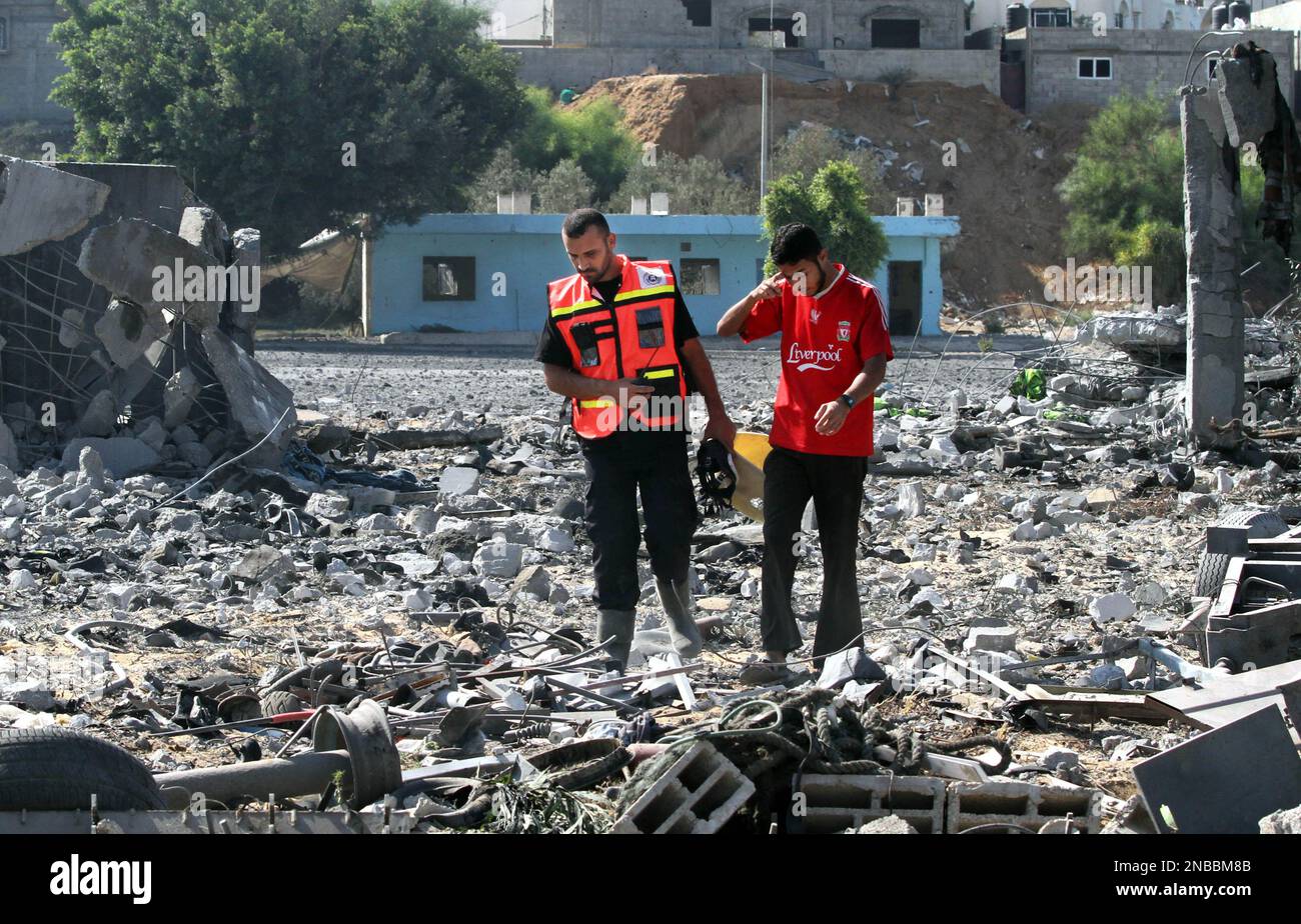 Palestinians inspect the damage at a Hamas training camp following an ...