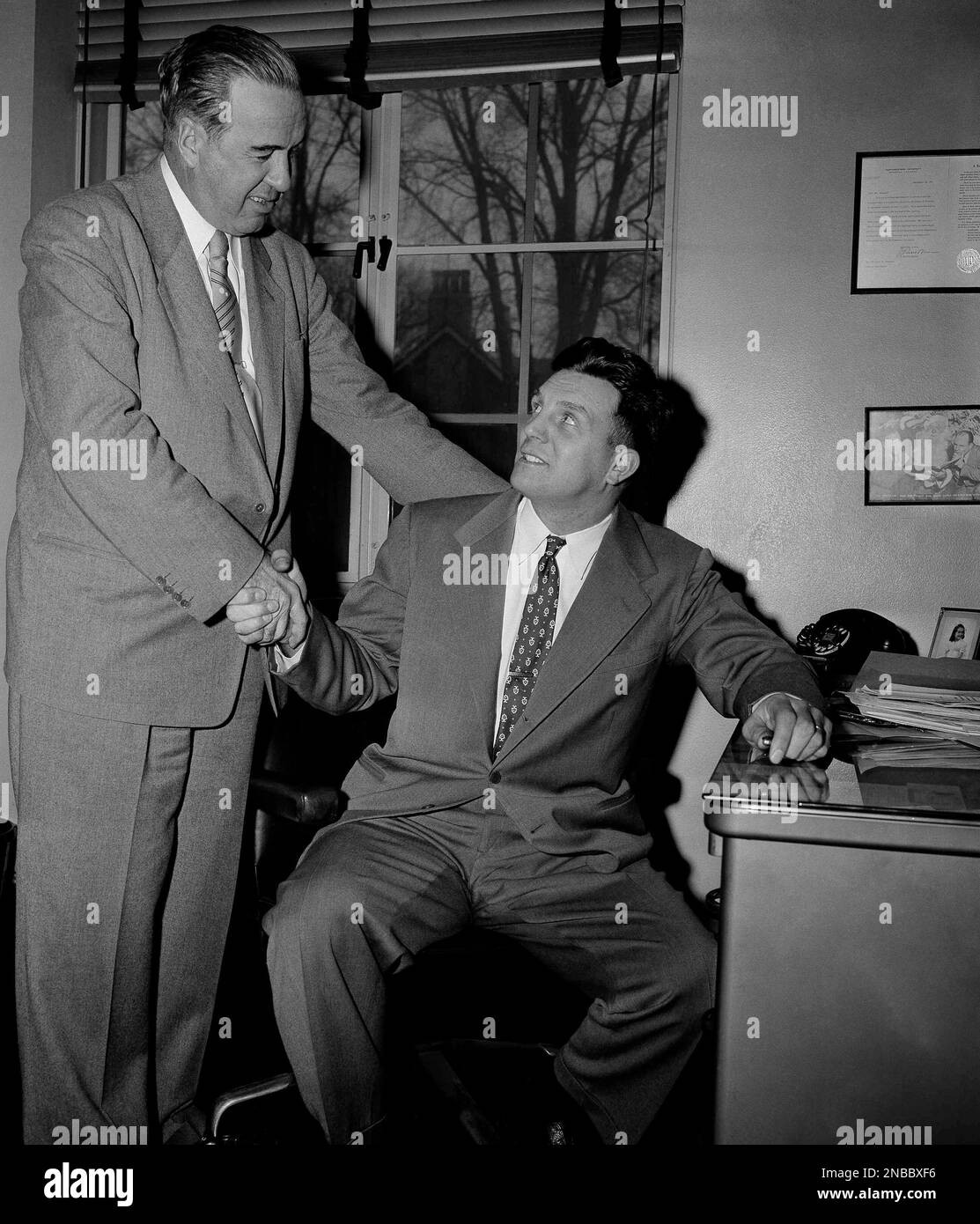 Lou Saban, sitting, 33-year-old assistant football coach at ...