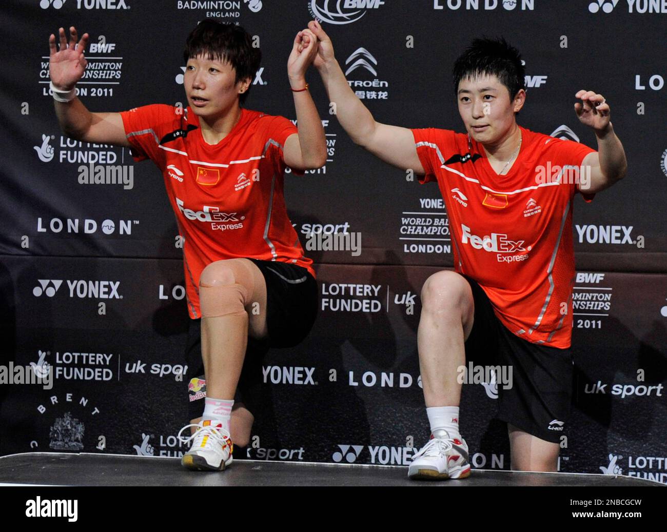 China's Xiaoli Wang, left, and Yang Yu step onto the gold medal podium ...