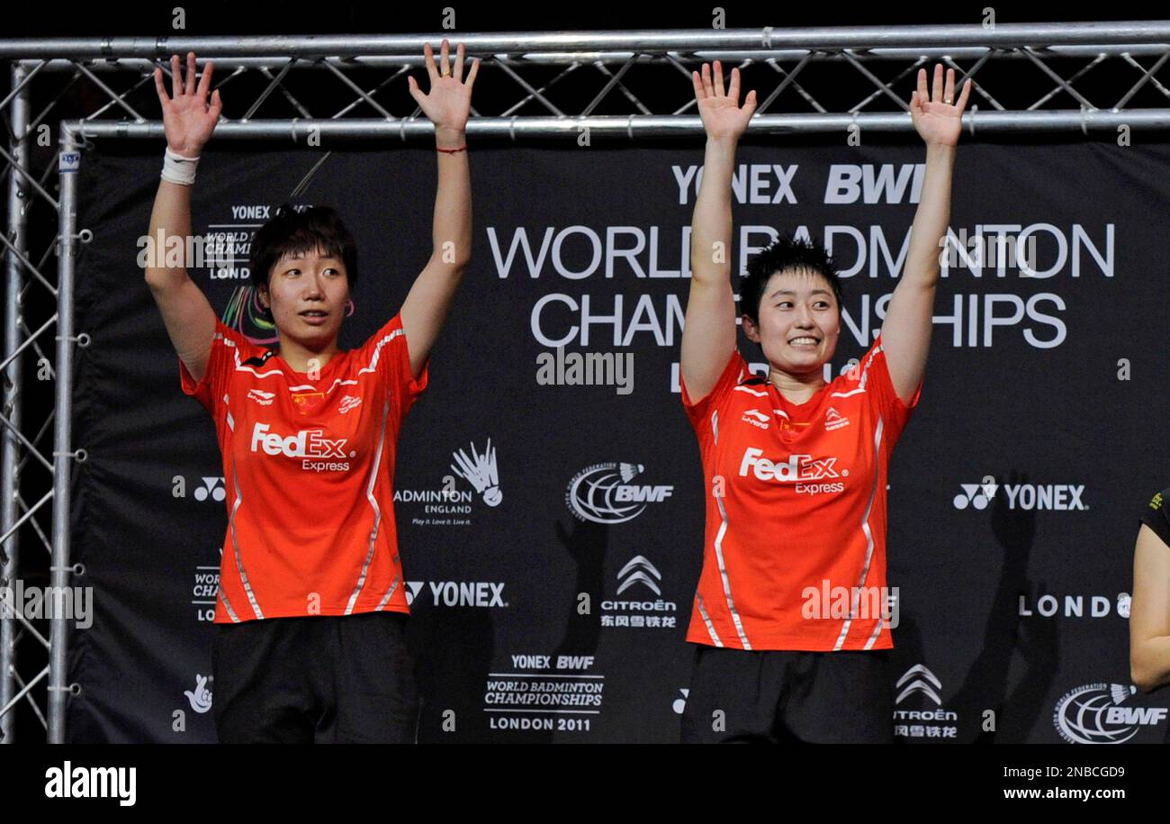 China's Xiaoli Wang, left, and Yang Yu step onto the gold medal podium ...