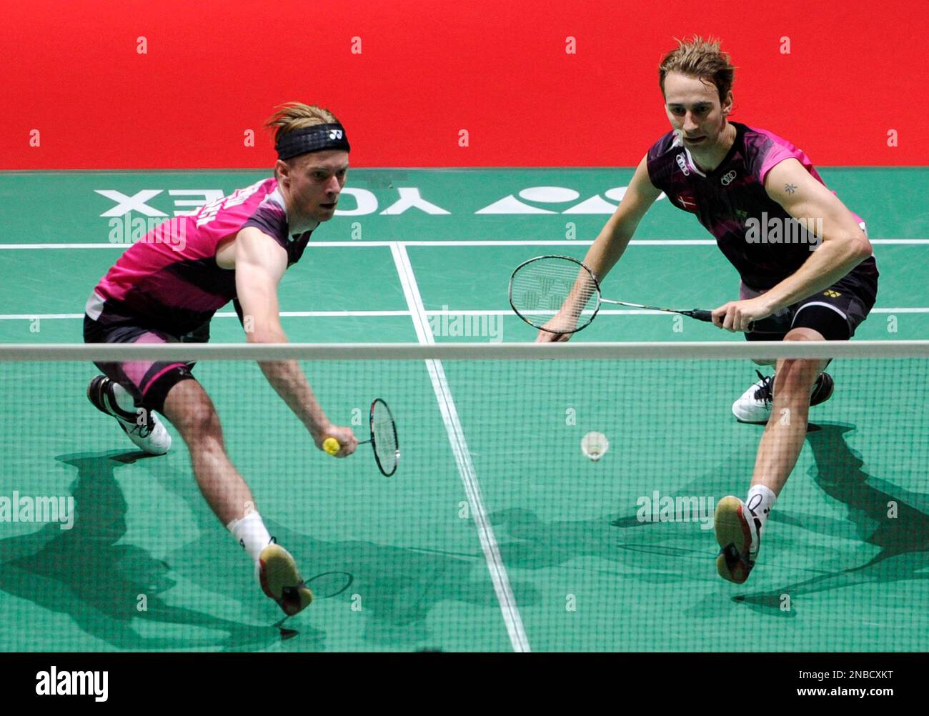 Denmark's Mathias Boe, left, and Carsten Mogensen return a shot to ...