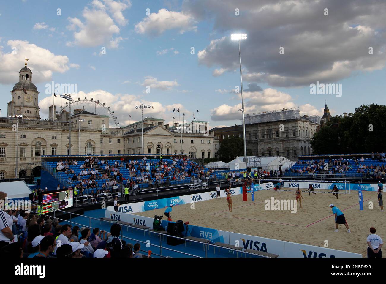 U.S.A's April Ross and Jennifer Kessy, left, serve to Uganda's ...