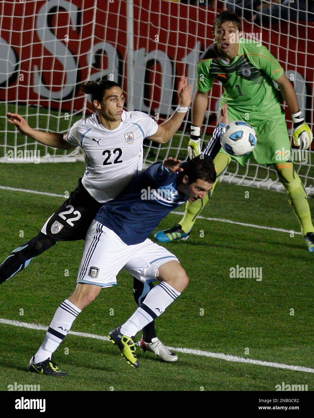 Argentina's Gonzalo Higuain, center, heads the ball to score a goal ...