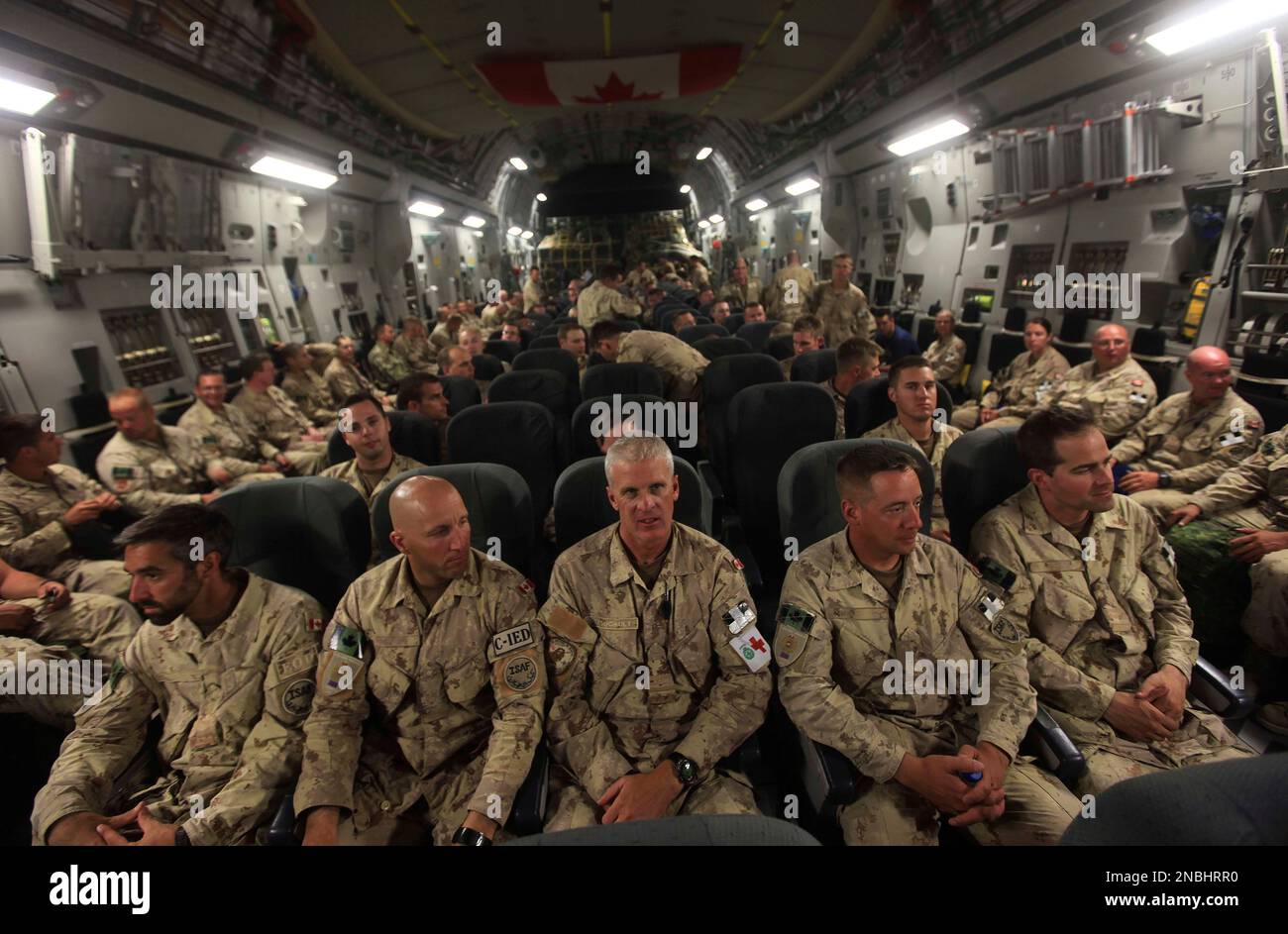 Canadian soldiers sits aboard a plane at Kandahar airbase in southern ...