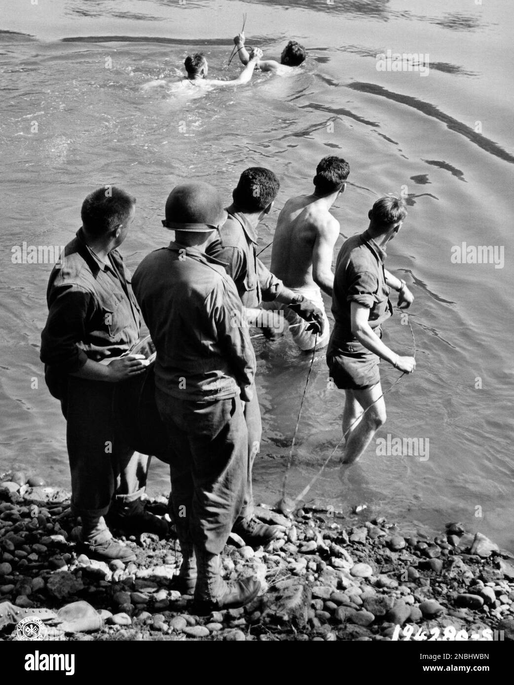 Communication lines laid across the Meselle river by a signal battalion ...