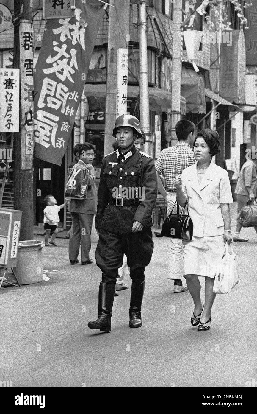 In full Nazi garb, including jackboots, steel helmet and rank insignia ...