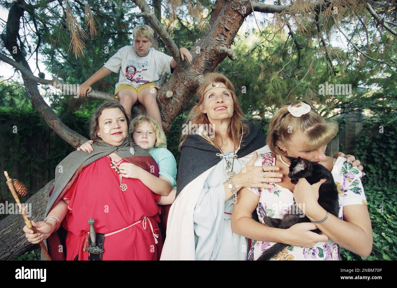 Witch Karlyn Streganona, left, her children Katherine, 11 and Mika 13 ...