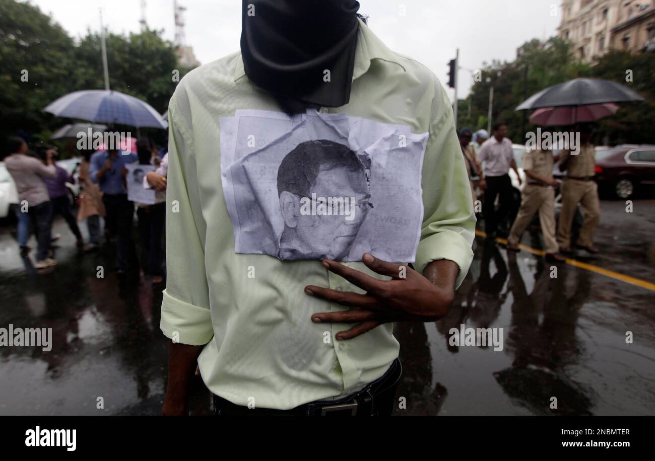 Indian journalists hold a photo of Jay Dey, a well-known investigative ...
