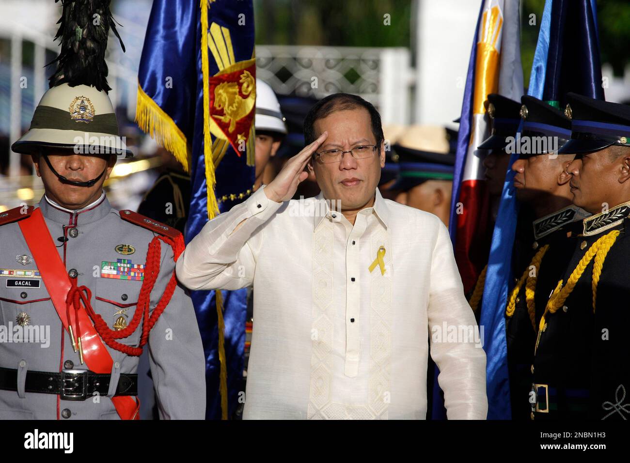 Philippines President Benigno Aquino salutes during arrival honors at ...