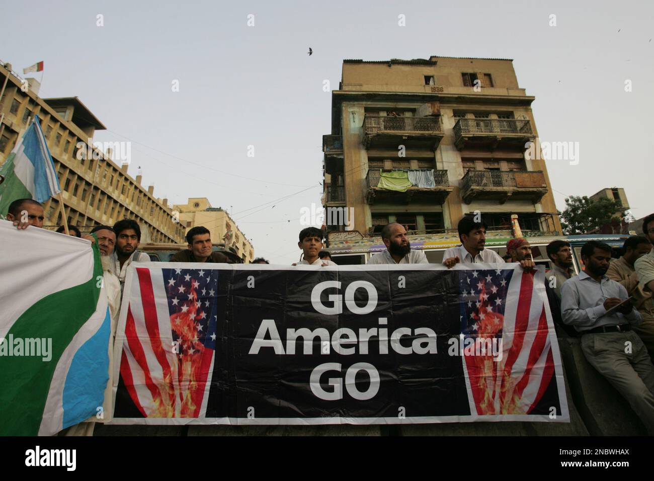 Supporters of the Pakistani religious party Jamaat-e-Islami, listen to ...